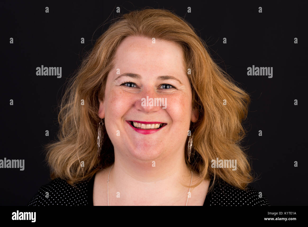 headshot portrait of attractive european girl in front of dark b Stock ...