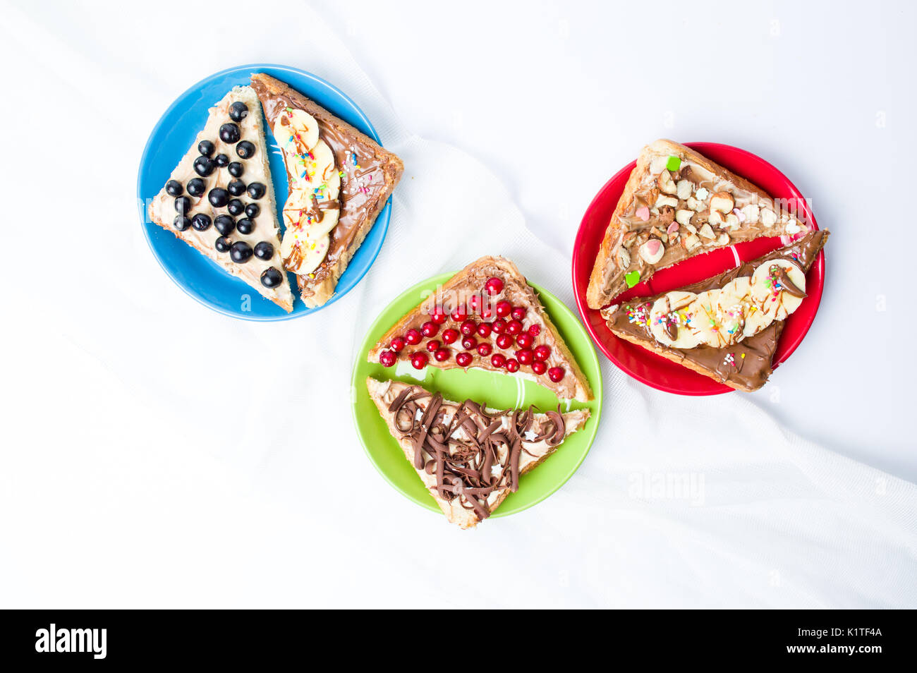 Sweet triangle sandwiches with fruit and cream Stock Photo - Alamy