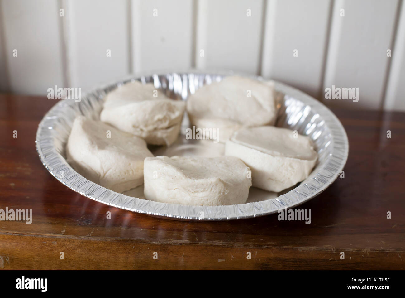 Raw biscuits prepared for cooking in a pan Stock Photo - Alamy
