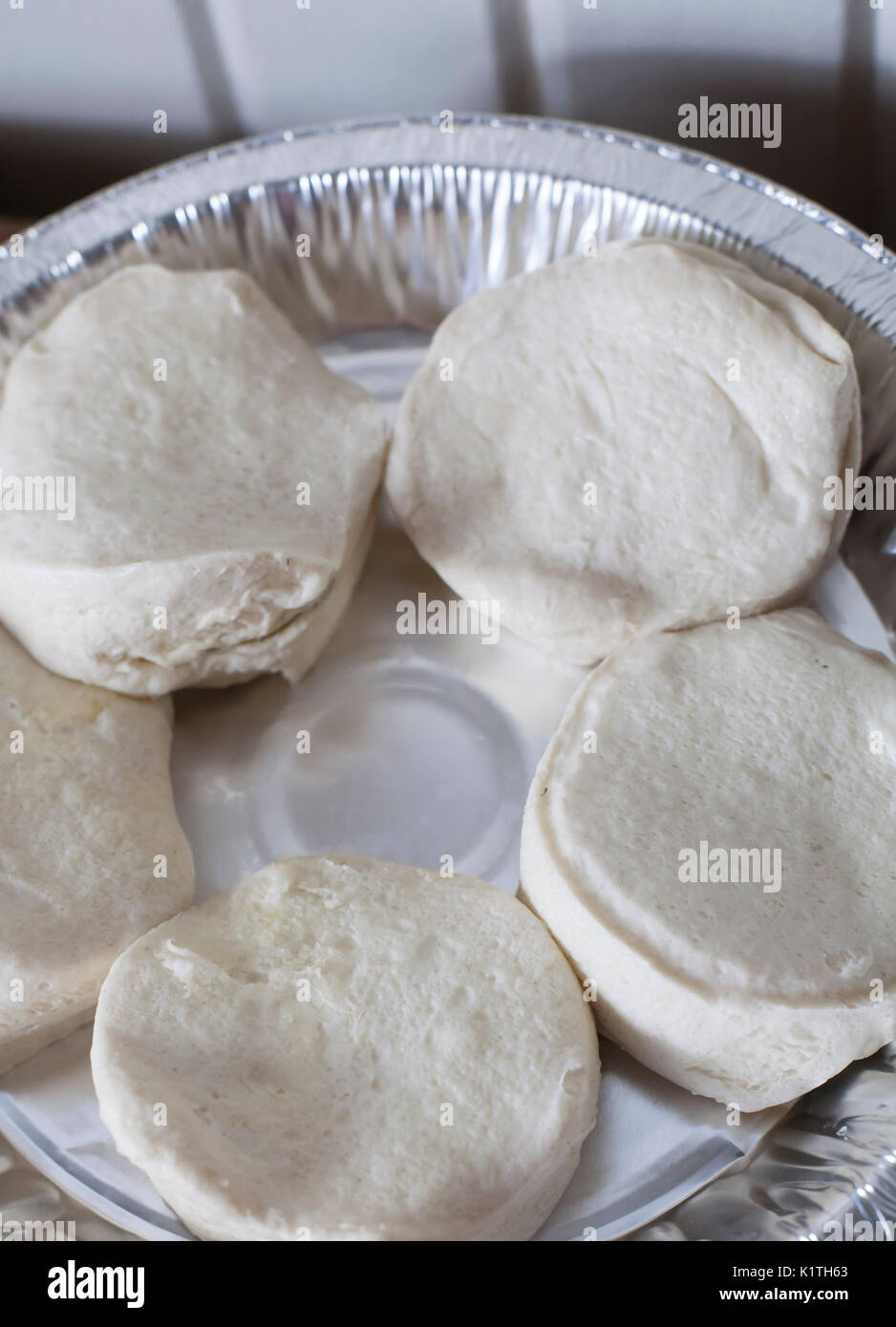 Raw biscuits prepared for cooking in a pan Stock Photo - Alamy