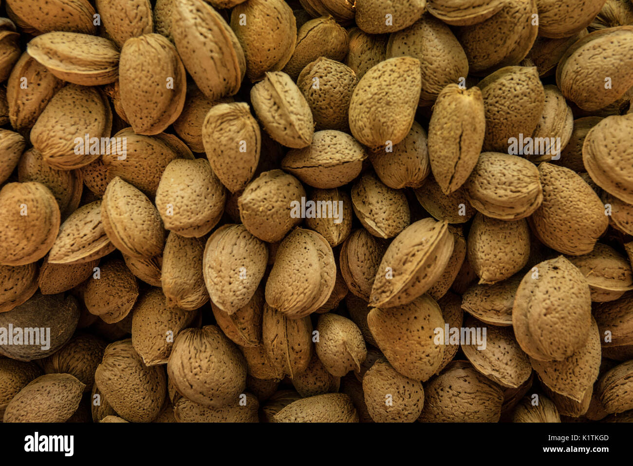 Almonds texture. Almonds background. almonds with hull Stock Photo - Alamy
