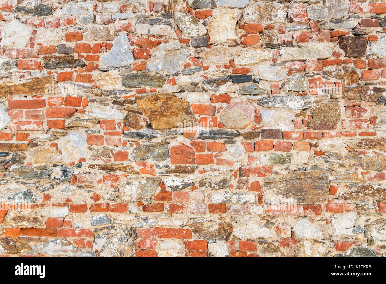 Details of a wall made of bricks and rubble stones Stock Photo - Alamy