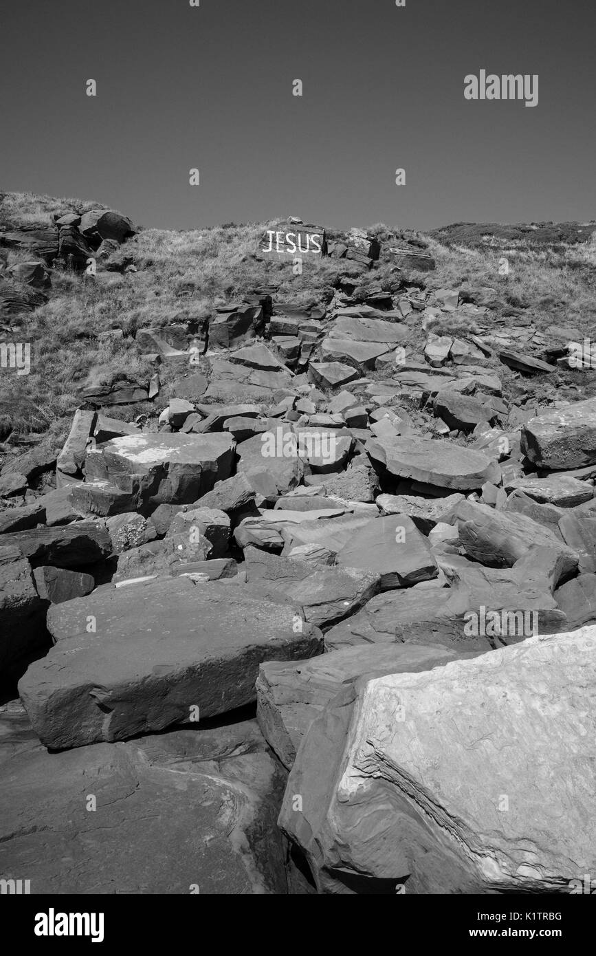 jesus painted in large white letters on st bees cliff Stock Photo - Alamy