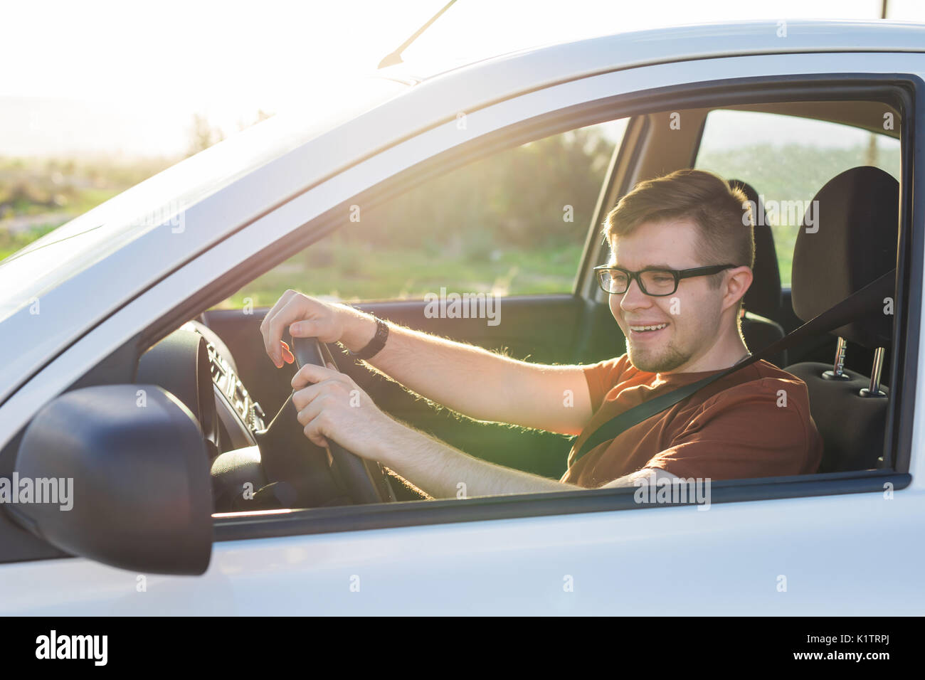 Tourist guy in car. Travel and summer vacation concepts Stock Photo - Alamy