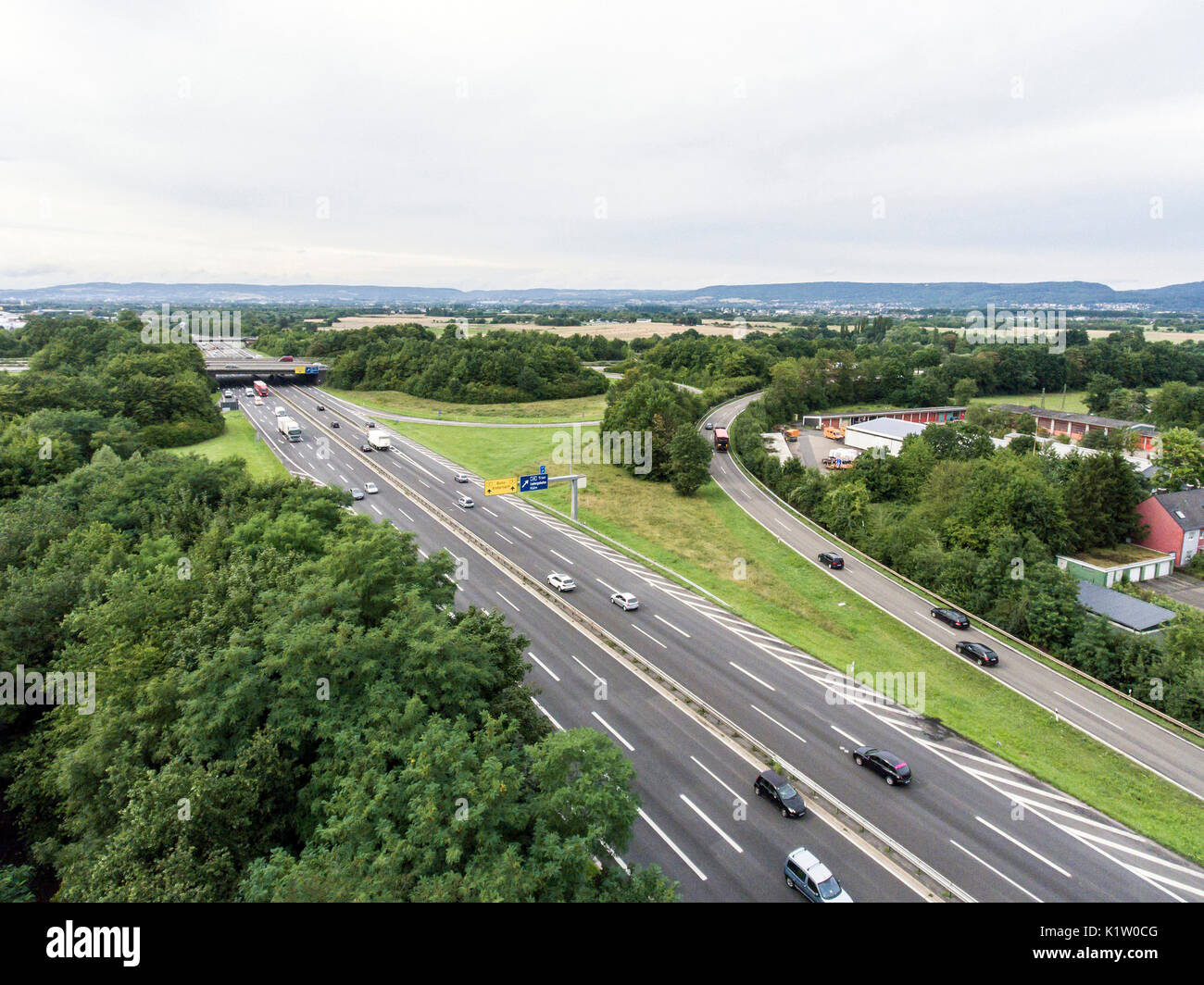 Aerial view of a highway intersection with a clover-leaf interchange in ...
