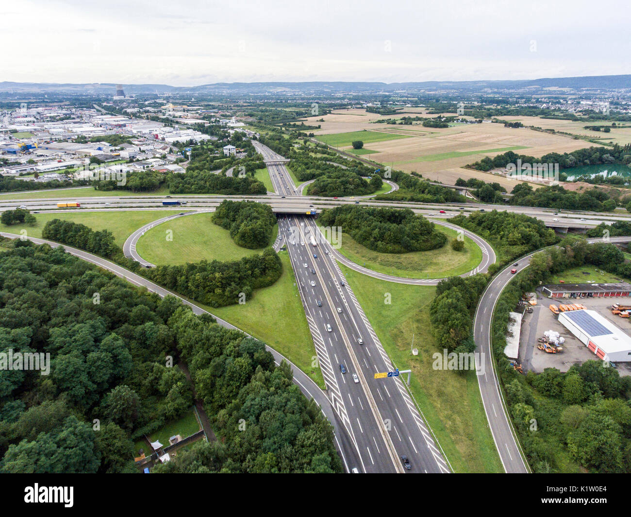 Aerial view of a highway intersection with a clover-leaf interchange in ...