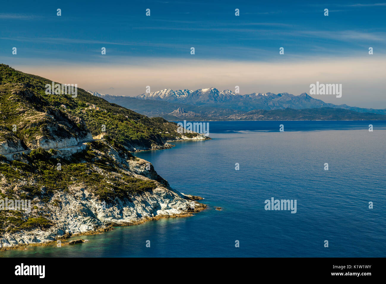 Mediterranean Sea coast, Monte Cinto mountain range in far distance ...