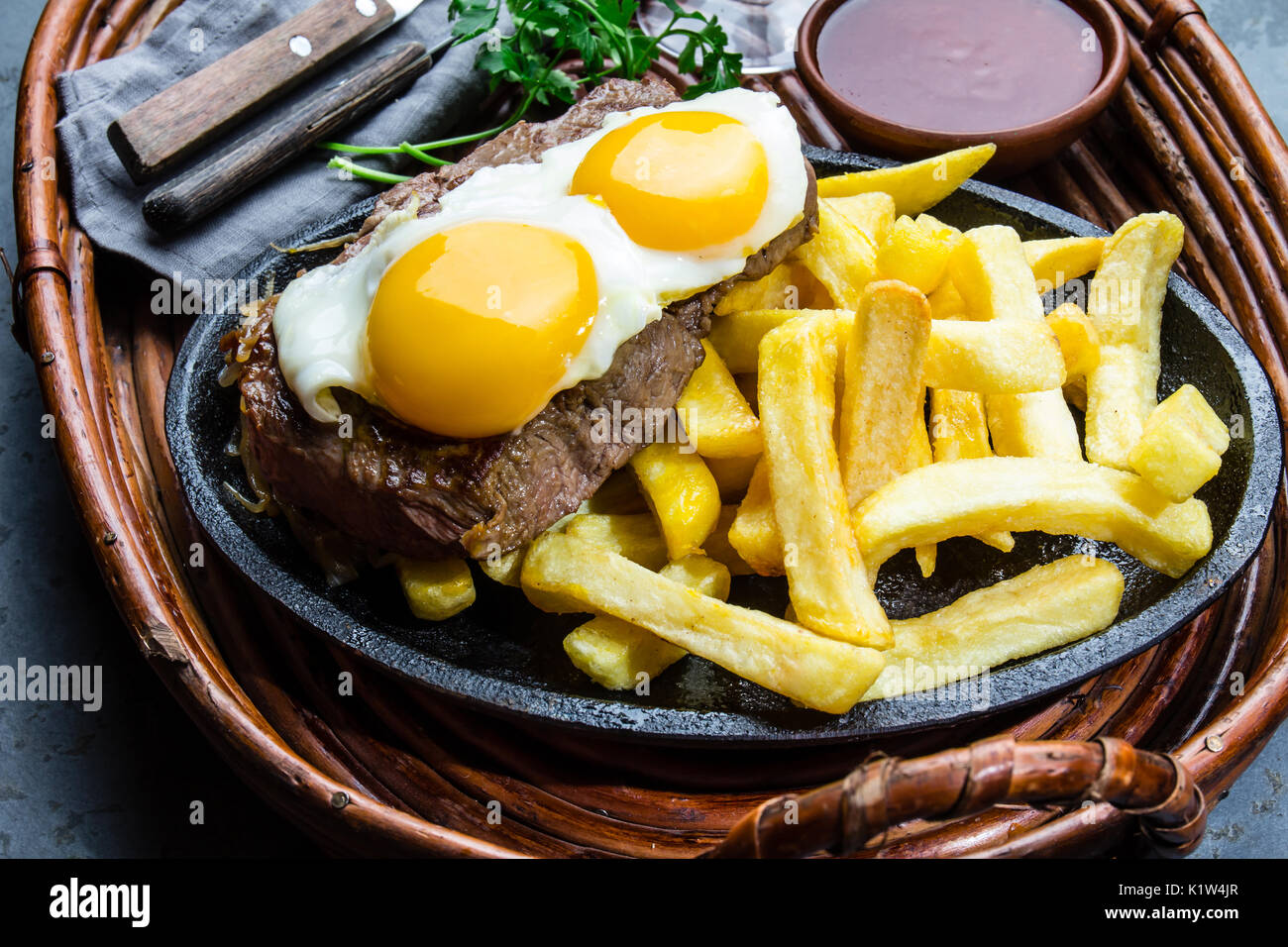 Peruvian Latin American food. Lomo a lo pobre. Beef tenderloin whit ...
