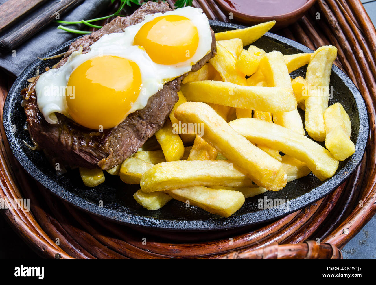 Peruvian Latin American food. Lomo a lo pobre. Beef tenderloin whit ...
