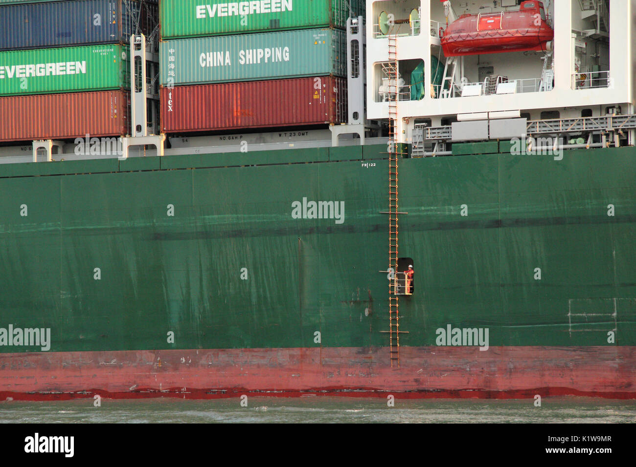 SAVANNAH, GA – JULY 22: A cargo ship makes its way along the Savannah ...