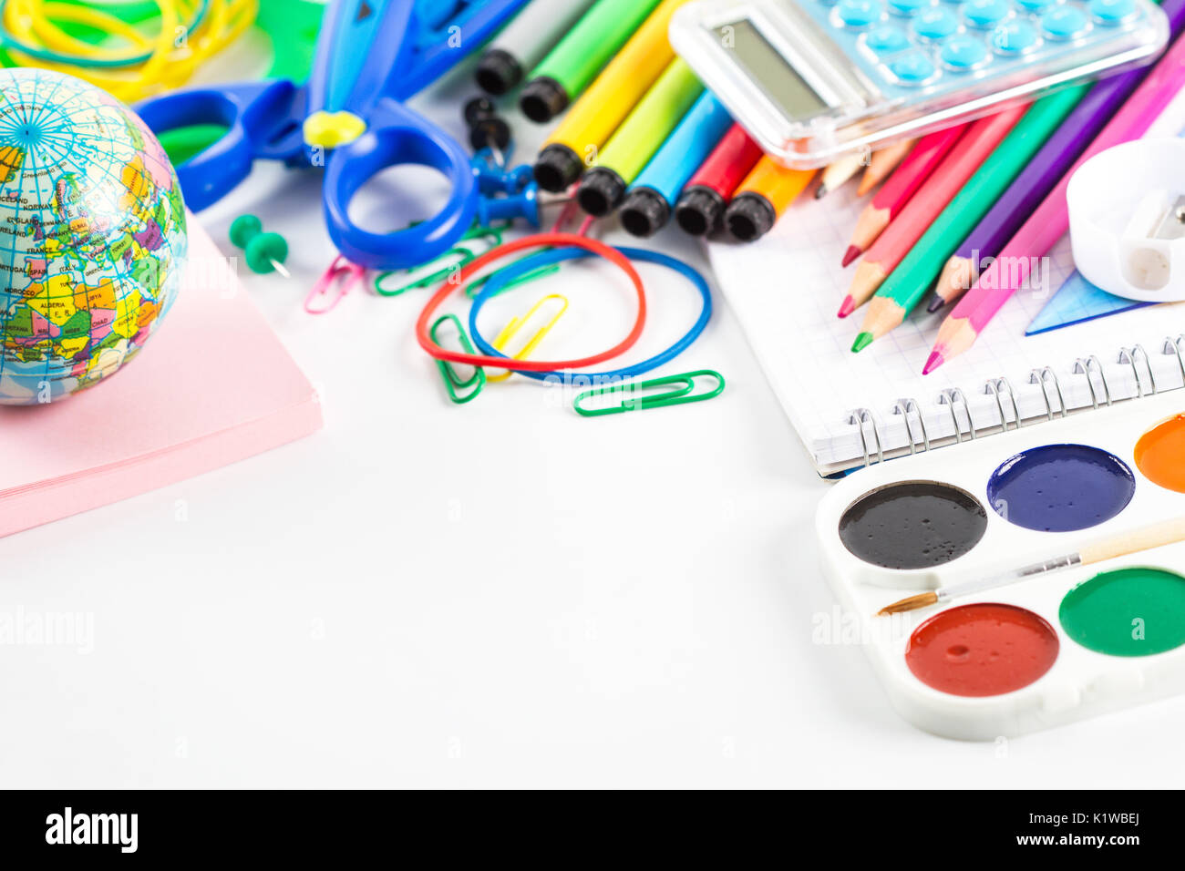 Assortment of school supplies on white background Stock Photo - Alamy