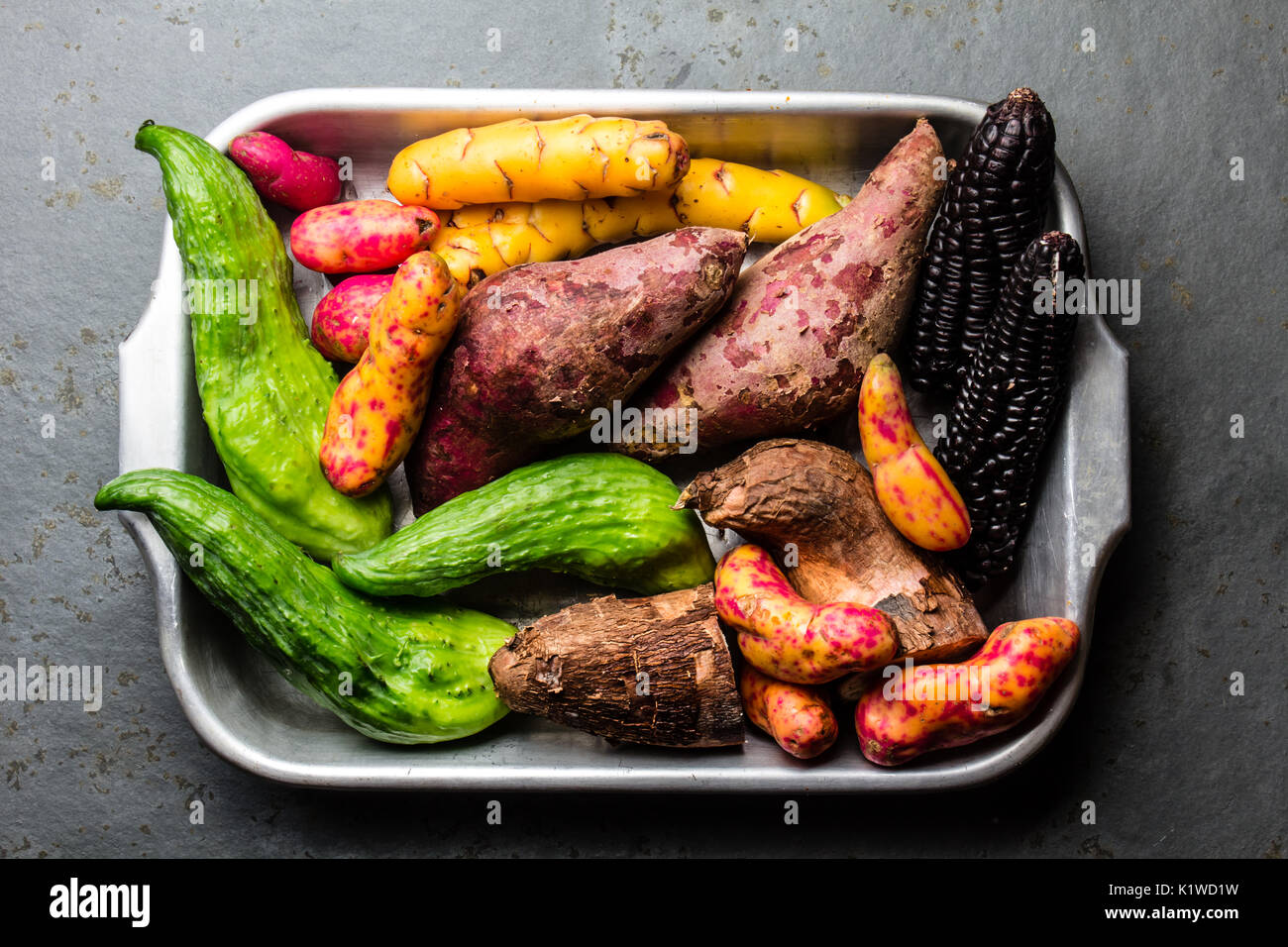 Fresh peruvian Latin American vegetables caigua, sweet potatoes, black ...