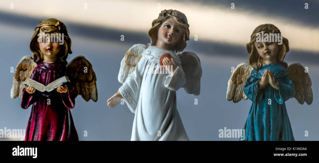 Three Christmas angels celebrate the birth of baby Jesus Stock Photo ...