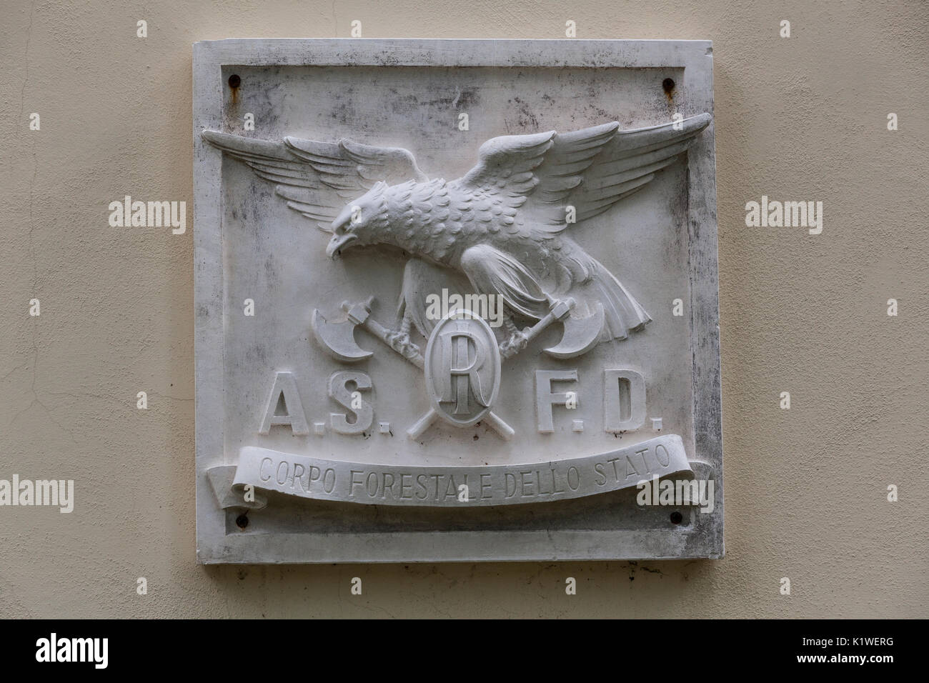 Marble bas-relief with the old symbol of the State Forestry Corps, with ...