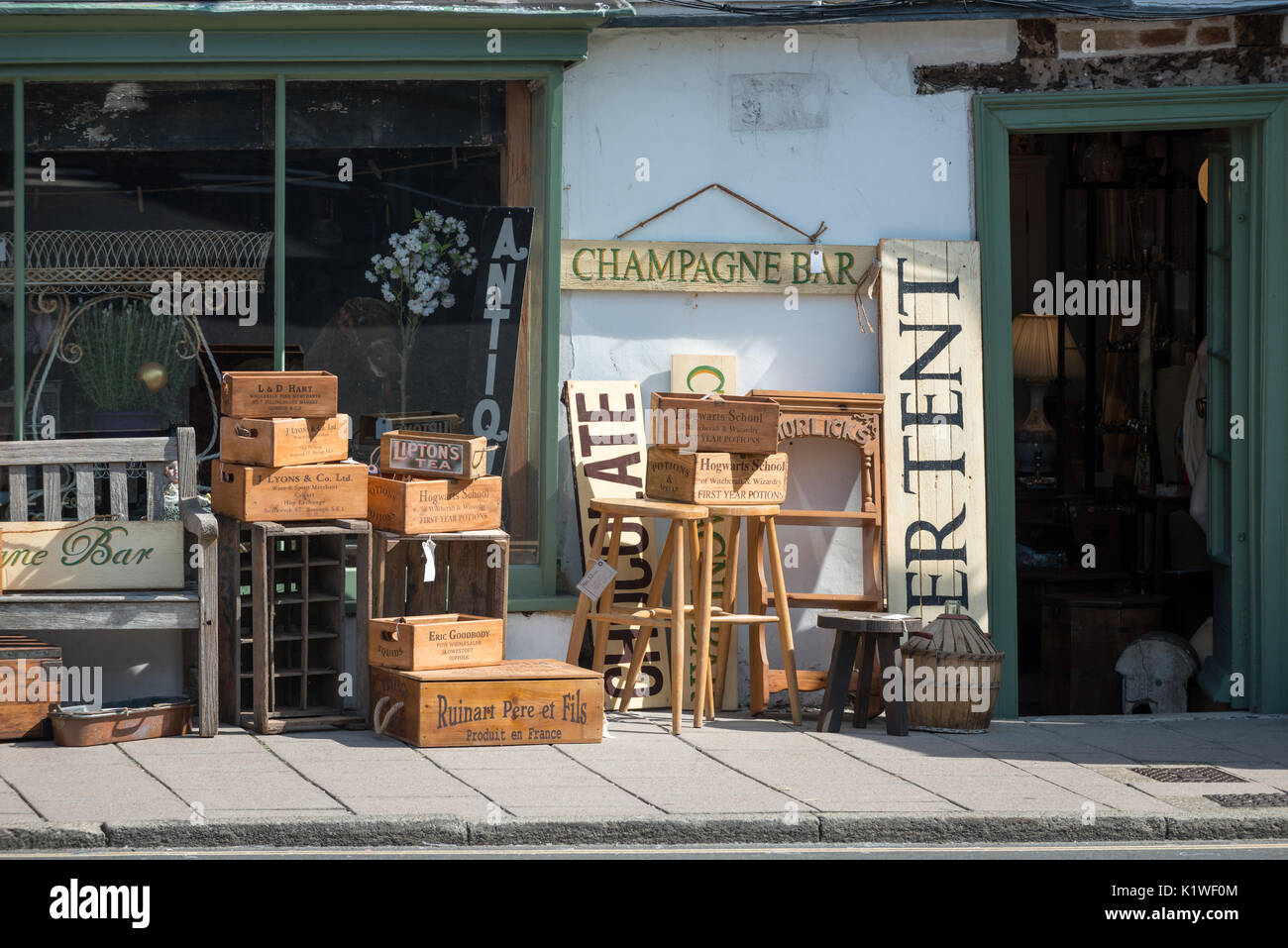 Wooden boxes and other items for sale outside a antiques shop in ...