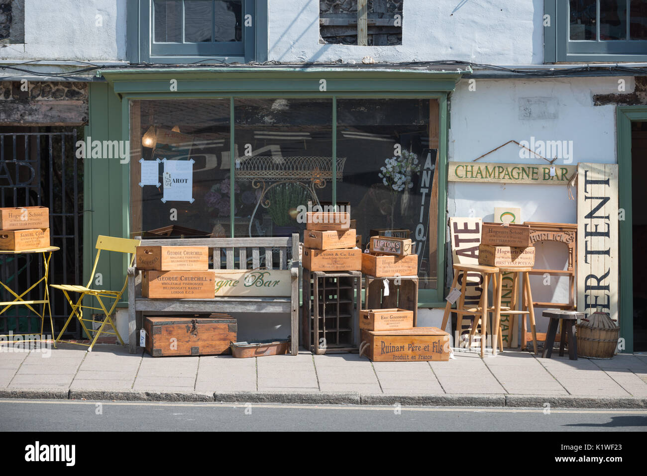 Wooden boxes and other items for sale outside a antiques shop in ...