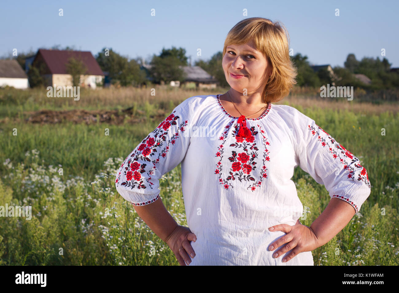 Happy woman smiling in the nature background Stock Photo - Alamy