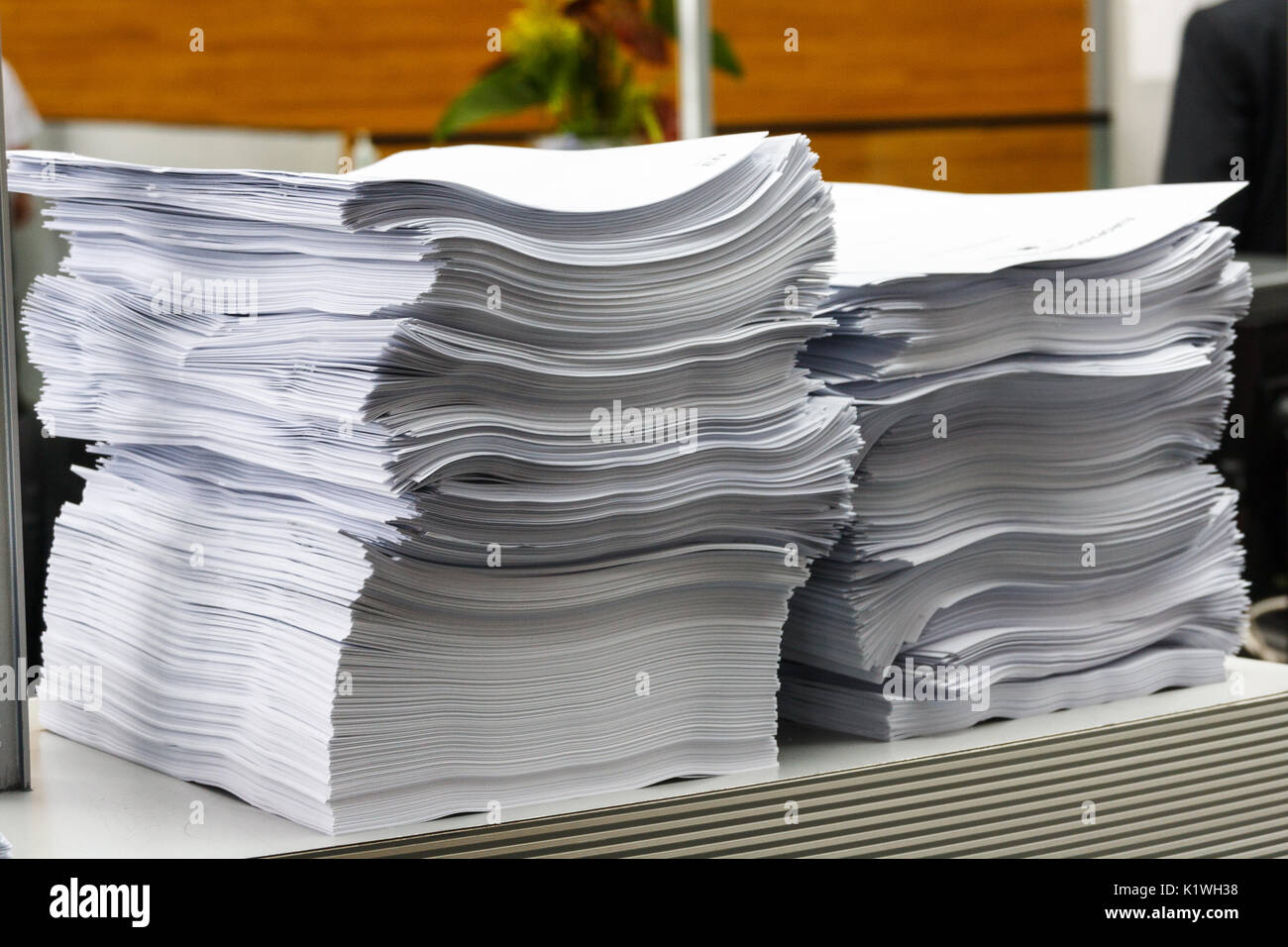 White paper irregular stack in the office Stock Photo - Alamy