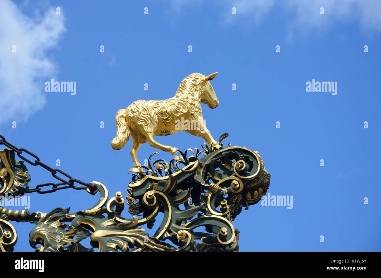 Golden sheep sculpture on sign Stock Photo - Alamy