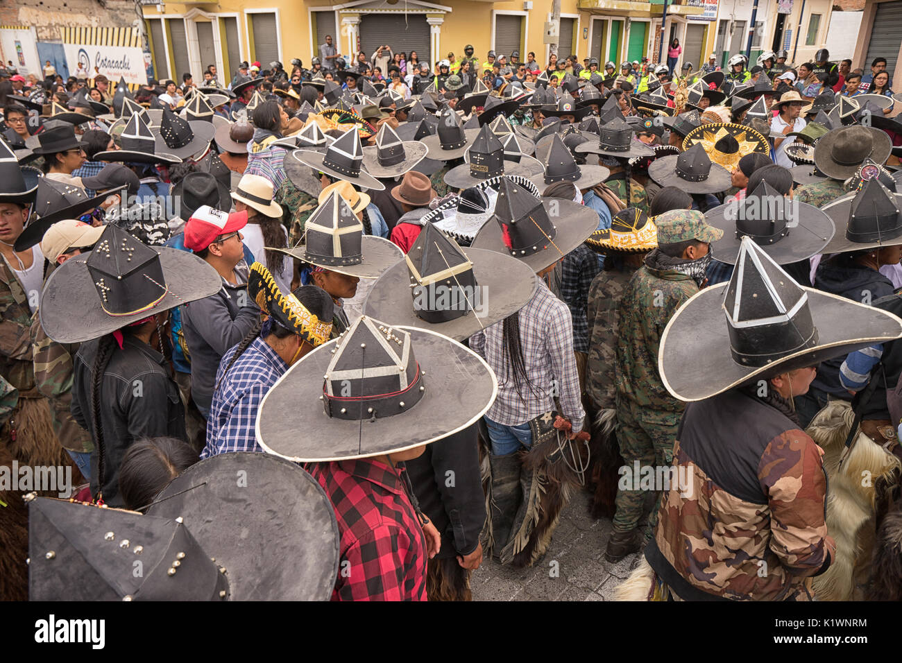 June 24, 2017 Cotacachi, Ecuador: street filled with dancing indigenous ...