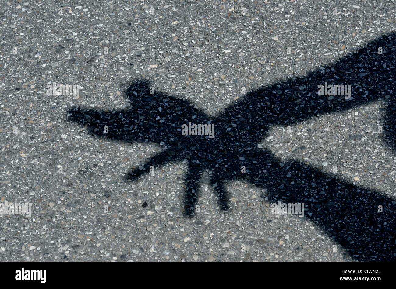 Hand Art - creating a graphic from of shadows on the street surface by ...