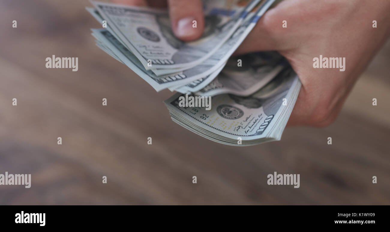 Close up hands counting new hi-res stock photography and images - Alamy