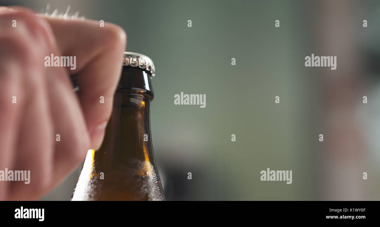 Hand opening bottle beer hi-res stock photography and images - Alamy