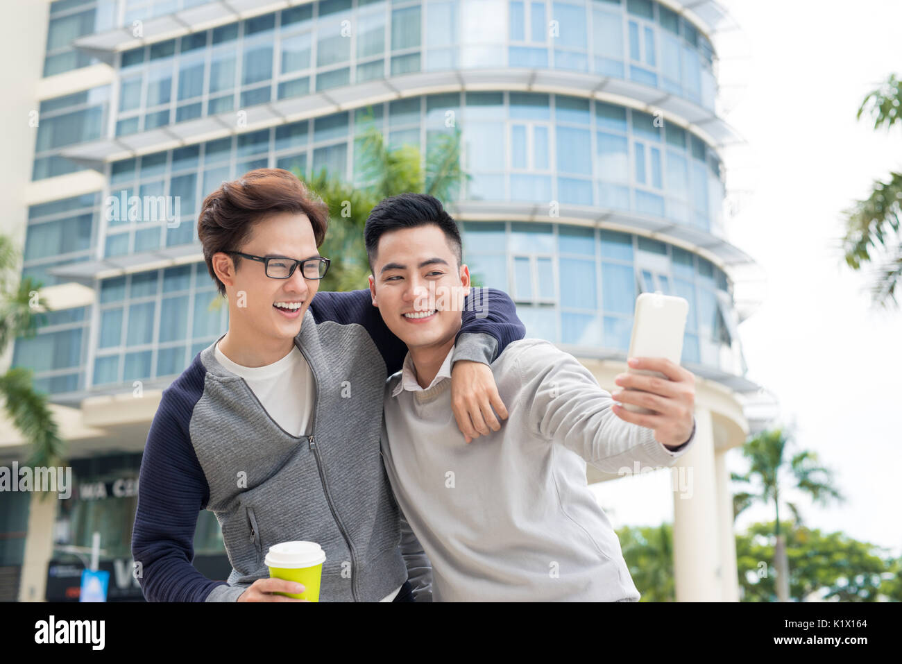 Two young man video call using smartphone Stock Photo - Alamy