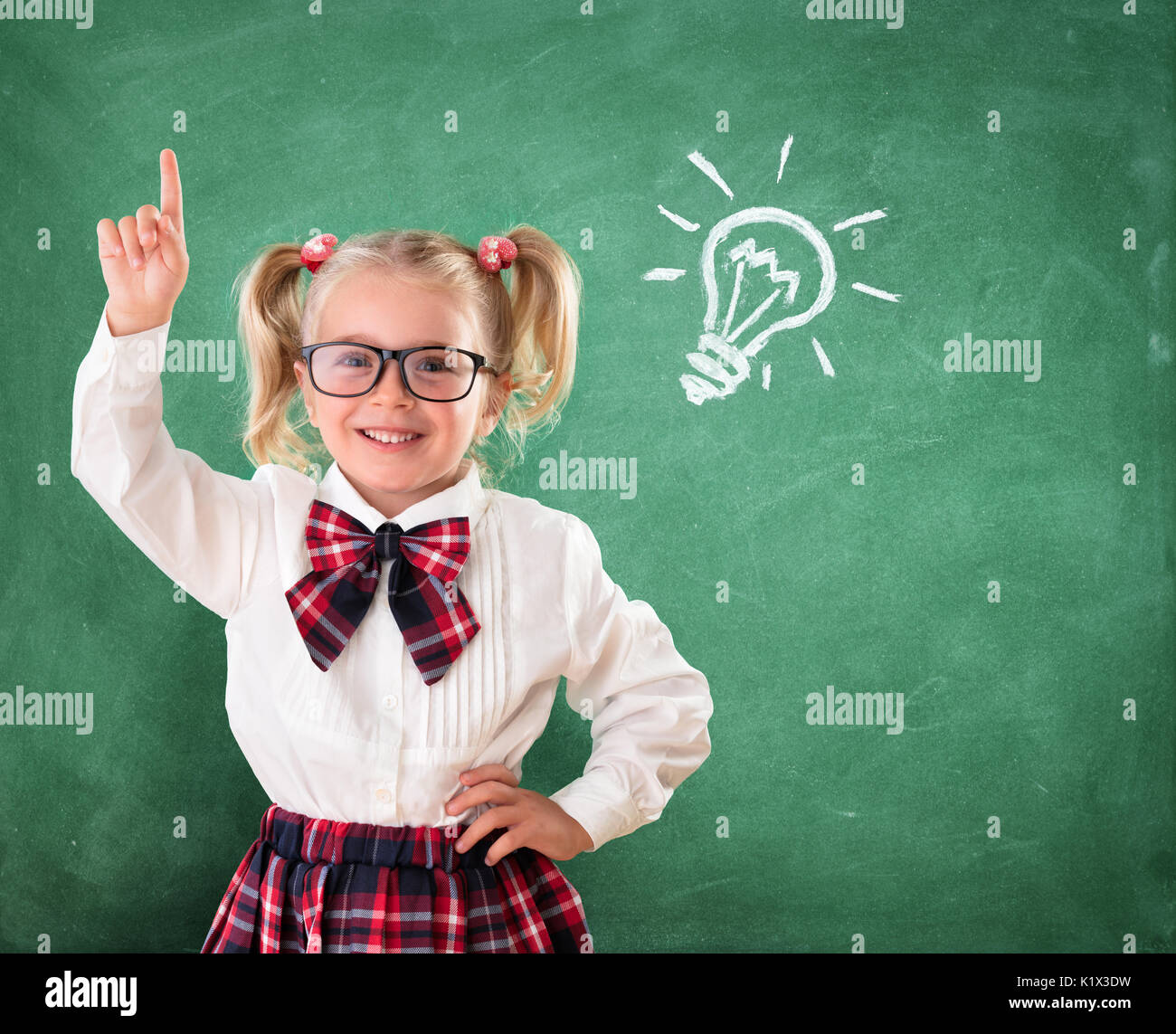 Little Student With Idea In Classroom Stock Photo - Alamy
