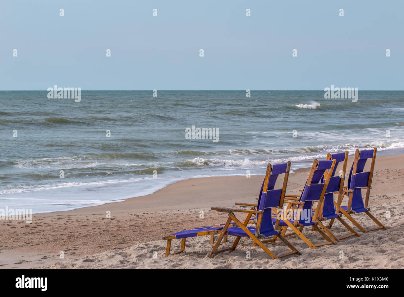 Four Chairs on the Beach on a Clear Sunny Day Stock Photo - Alamy
