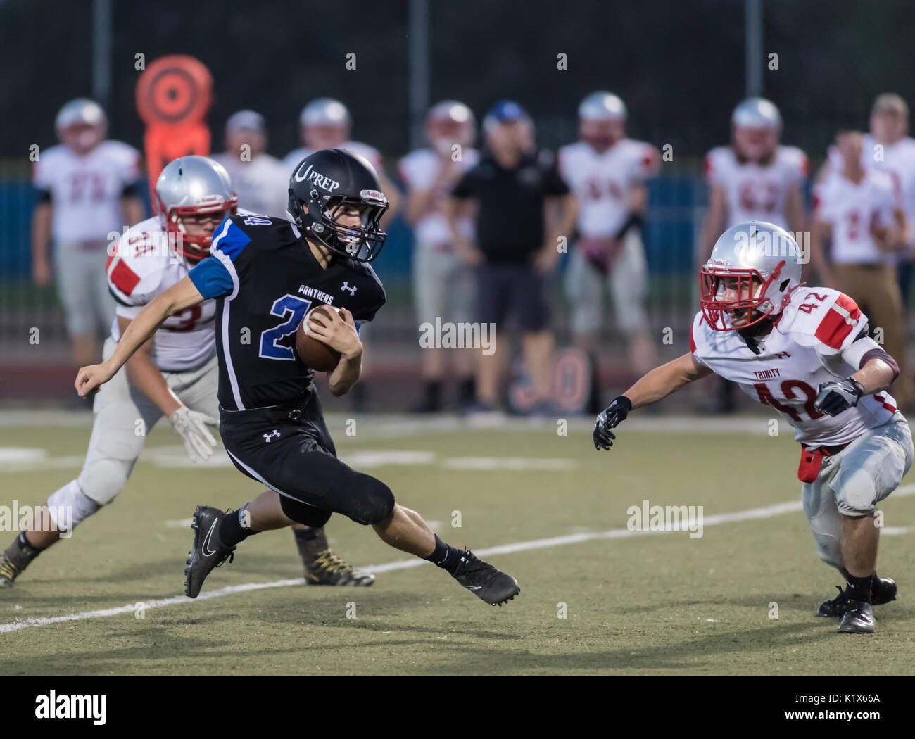 Football action with Trinity vs. University Prep High School in Redding ...