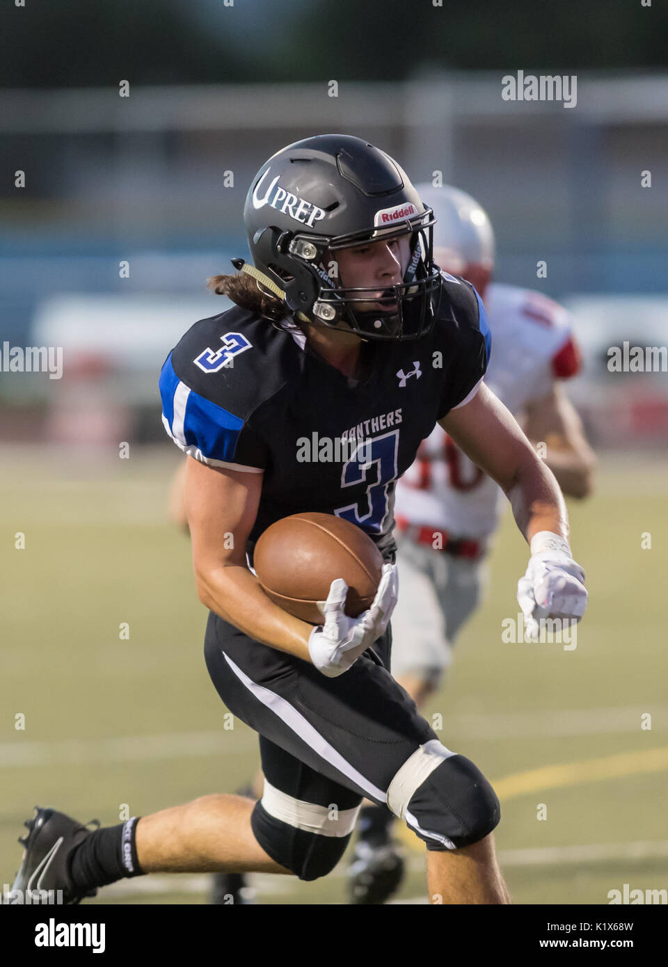 Football action with Trinity vs. University Prep High School in Redding ...