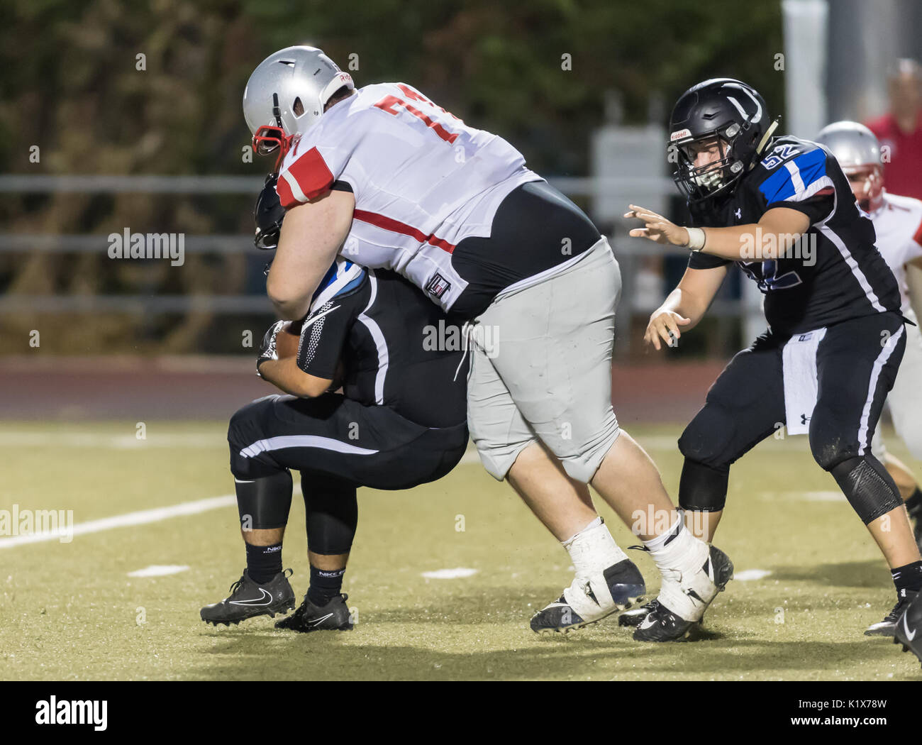 Football action with Trinity vs. University Prep High School in Redding ...