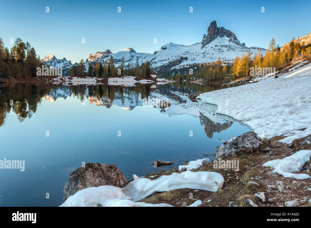 Alpine lake croda da lago hut with becco di mezzodi hi-res stock ...