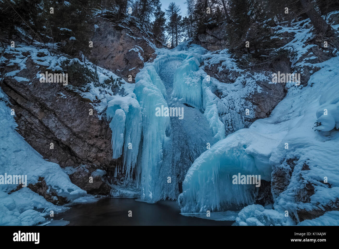 Europe, Italy, Veneto, Belluno. Frozen waterfall in the Natural Park of ...