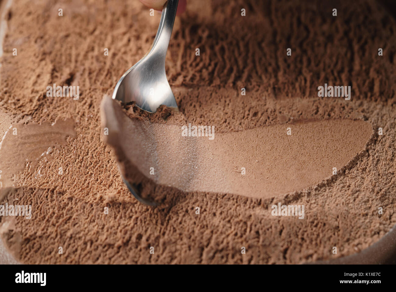 closeup scooping chocolate ice cream with spoon, shallow focus Stock ...