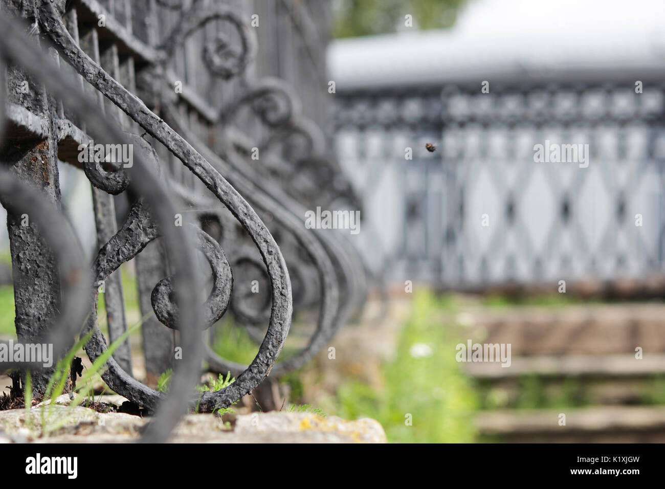 Metal historical bridge with openwork ornaments, painted gray paint ...