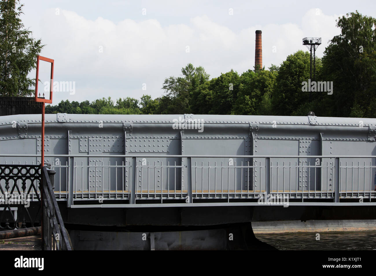 The bridge of metal parts over the dam is painted with gray paint. city ...