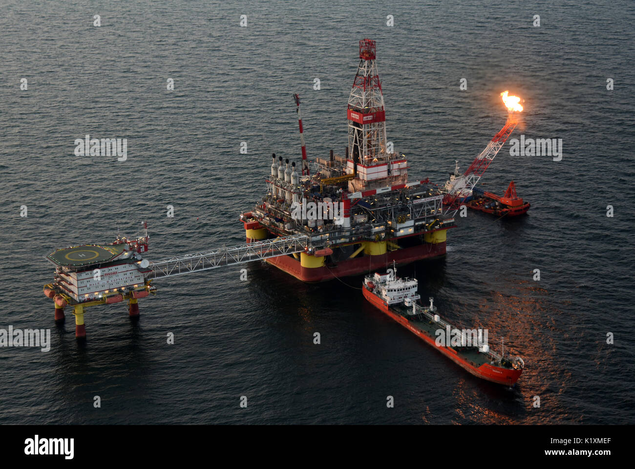 Oil rig platform at sunset on Lukoil Korchagina oil field at the north ...