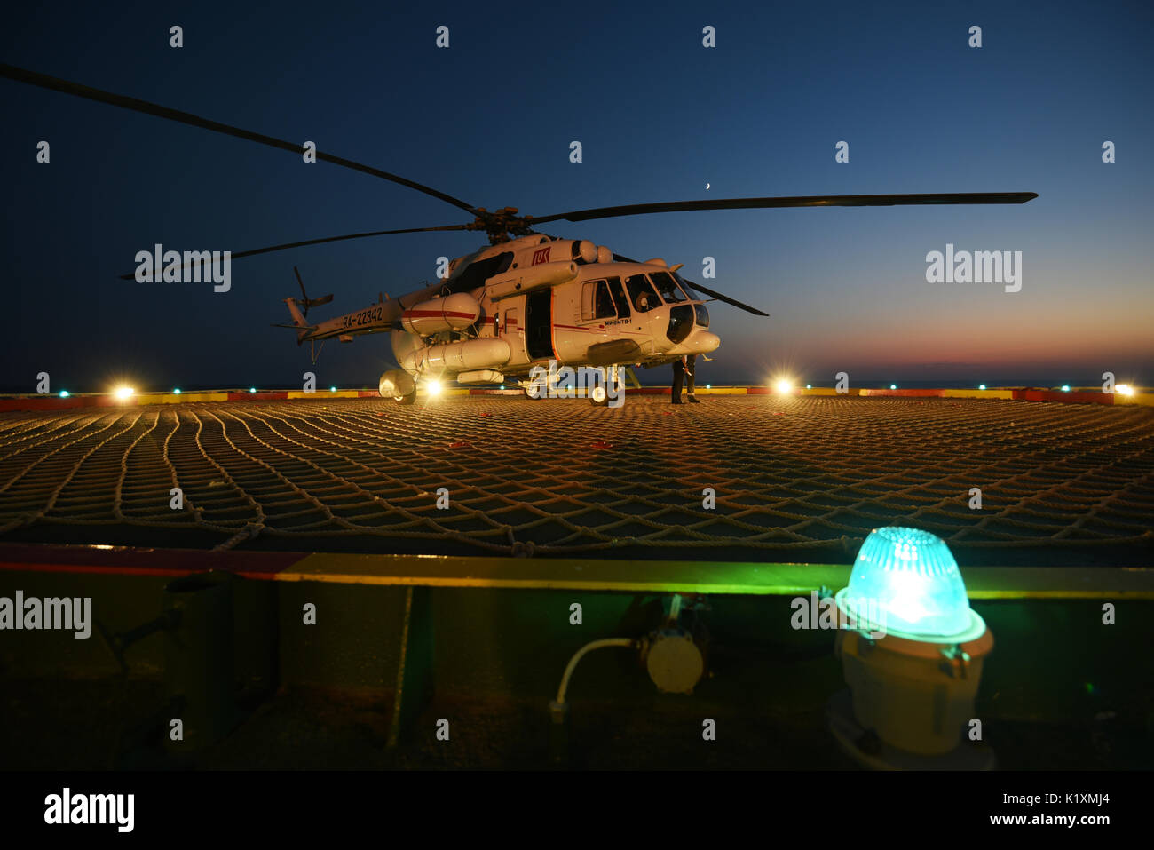 Helicopter on oil platform on Korchagina Lukoil oil field at the north ...