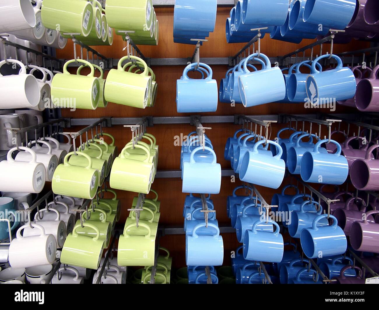 Photo of colorful ceramic mugs on display at a store Stock Photo - Alamy
