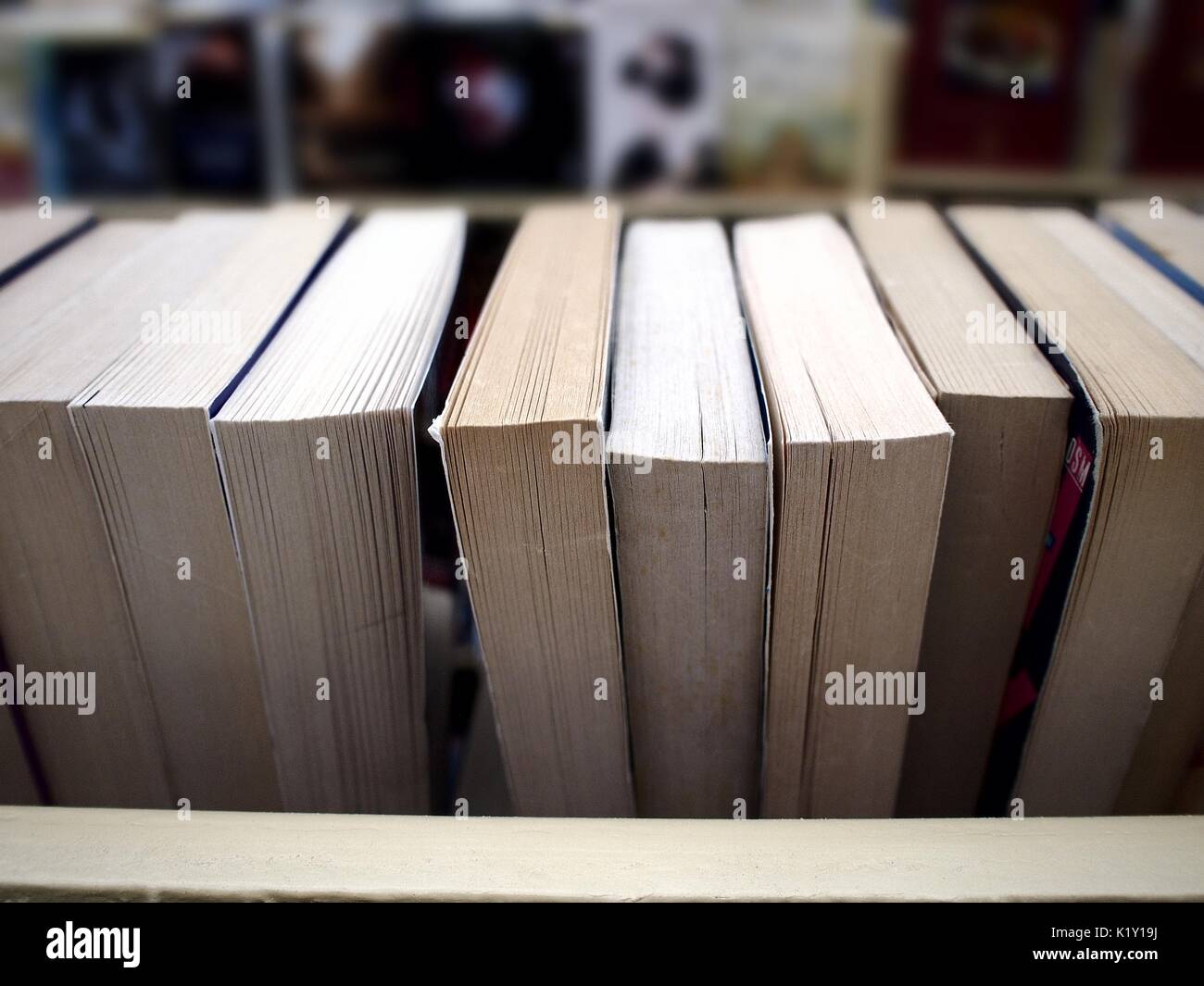 Photo of books arranged on a bookshelf Stock Photo - Alamy