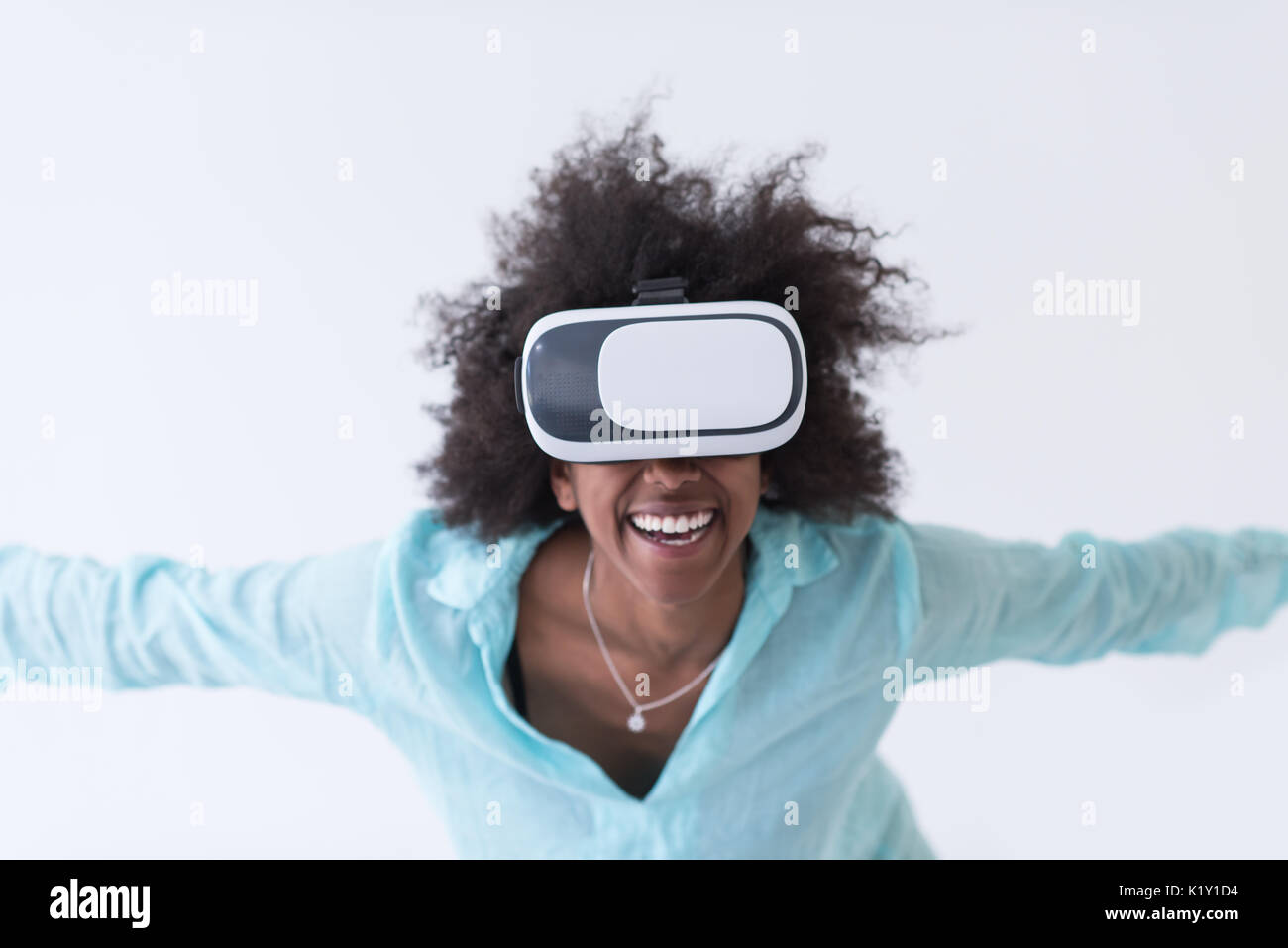 Happy african american girl getting experience using VR headset glasses ...