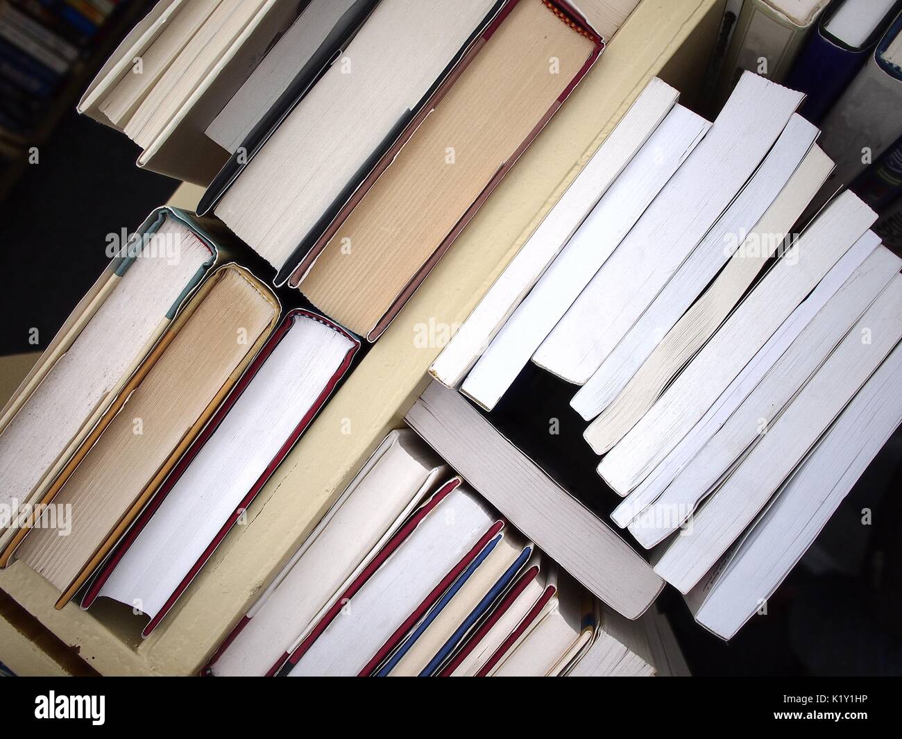 Photo of books arranged on a bookshelf Stock Photo - Alamy