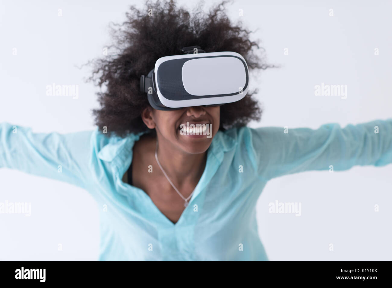 Happy african american girl getting experience using VR headset glasses ...