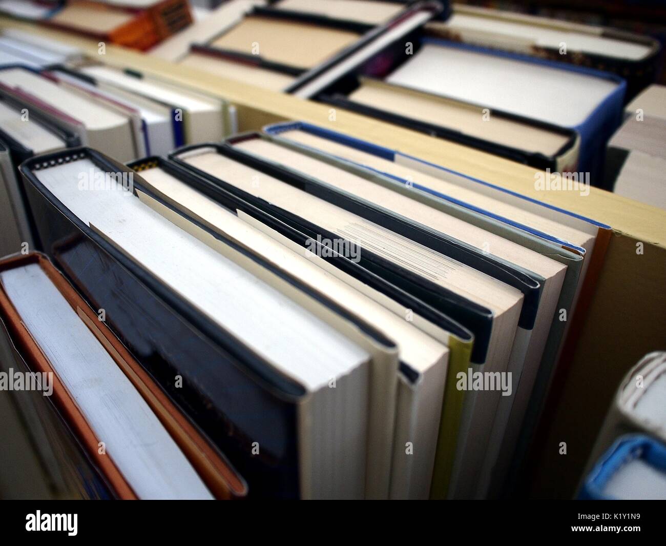 Photo of books arranged on a bookshelf Stock Photo - Alamy
