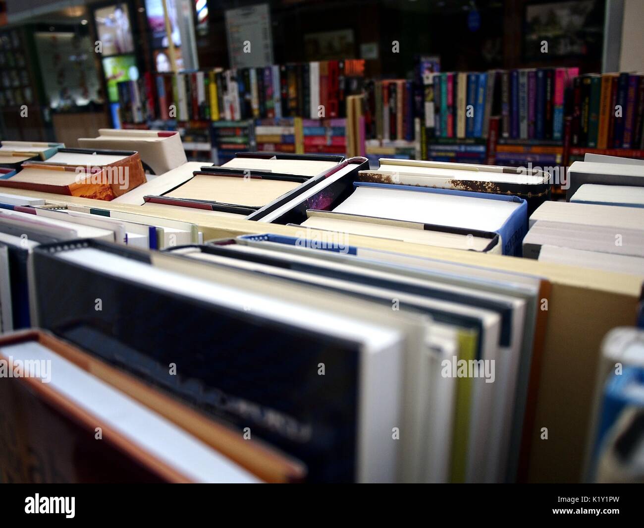 Photo of books arranged on a bookshelf Stock Photo - Alamy