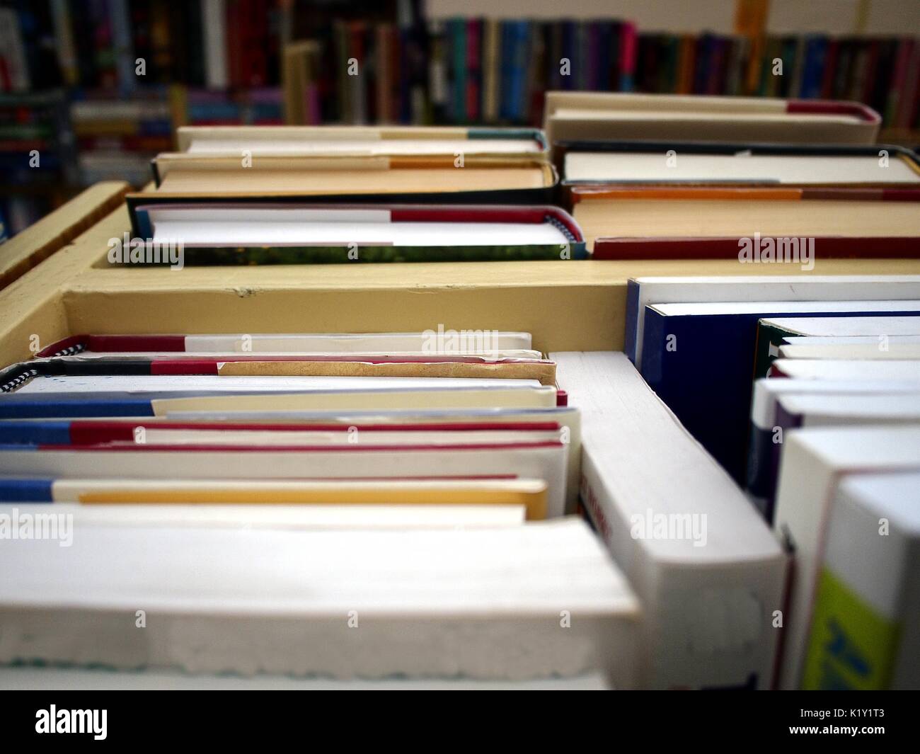 Photo of books arranged on a bookshelf Stock Photo - Alamy