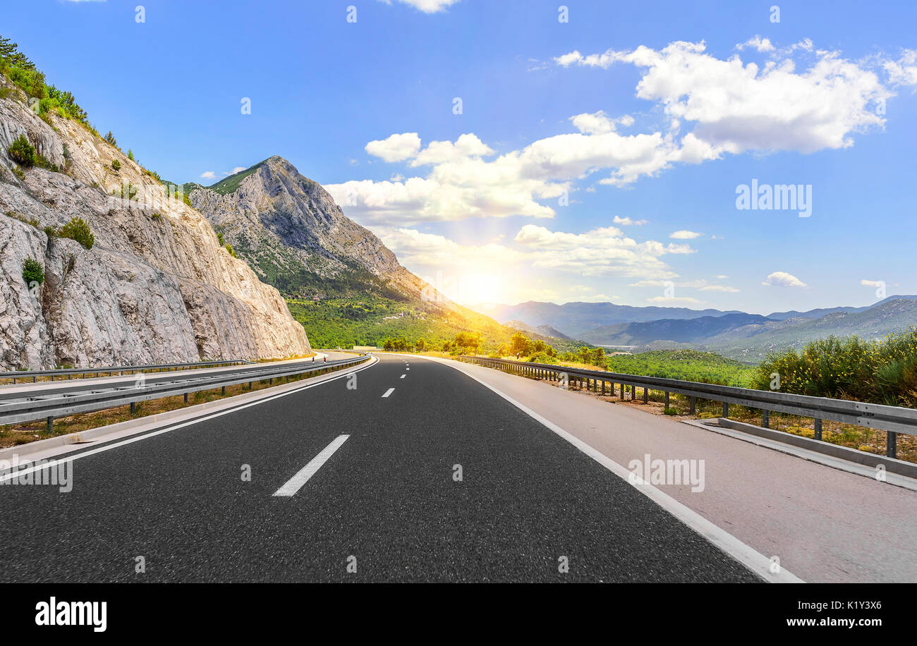 High-speed country road among the mountains Stock Photo - Alamy