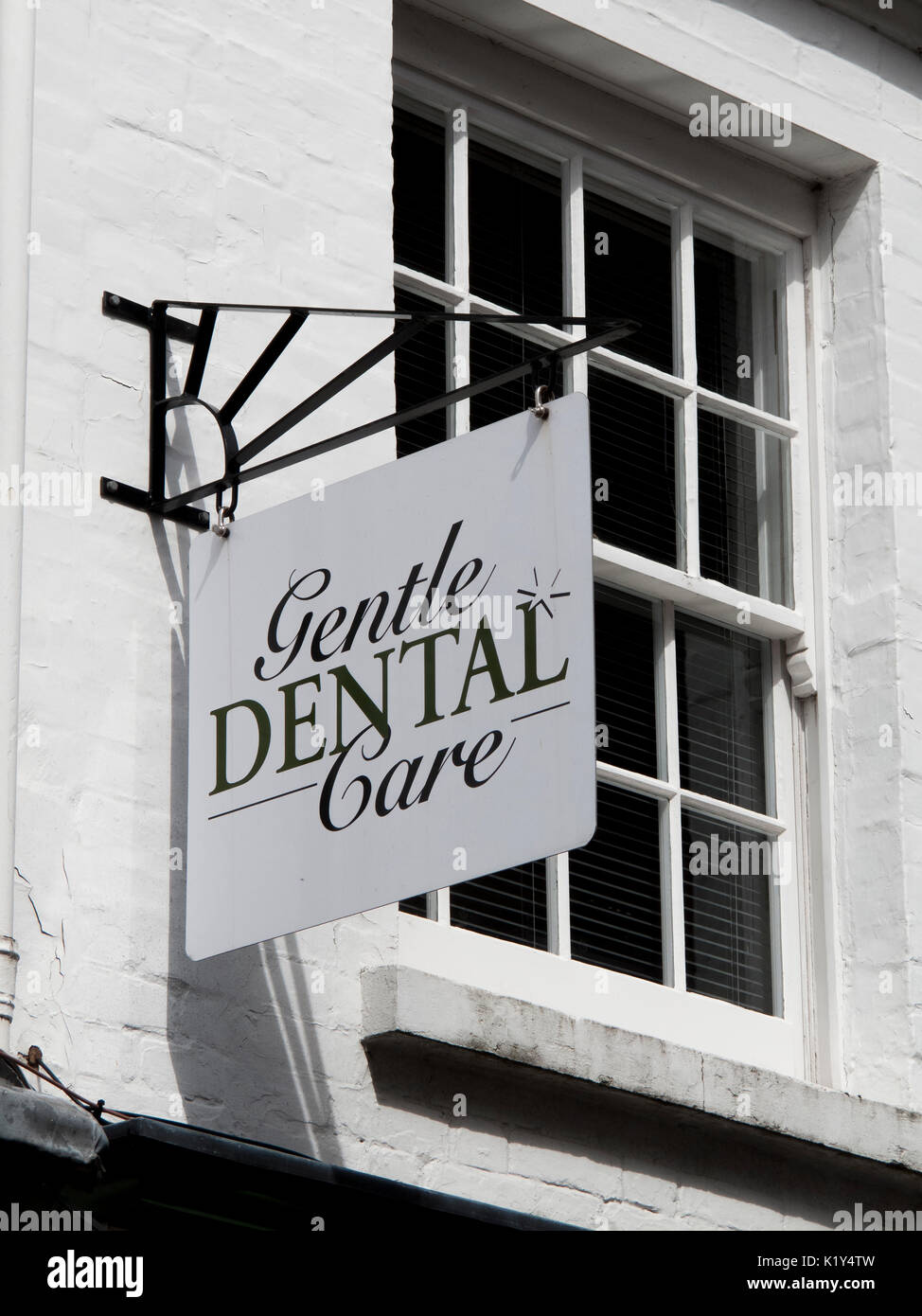Gentle Dental Care sign over dentist premises Stock Photo - Alamy
